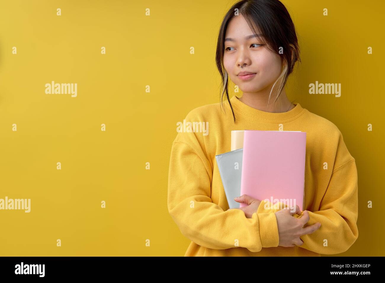 Portrait diligent asian woman hugging books reading education studying ...