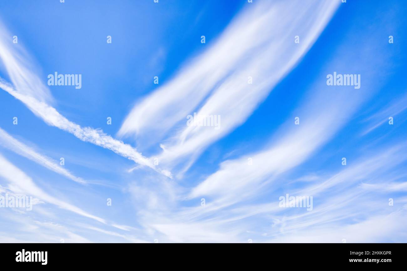 blue sky background with long clouds in spring Stock Photo - Alamy