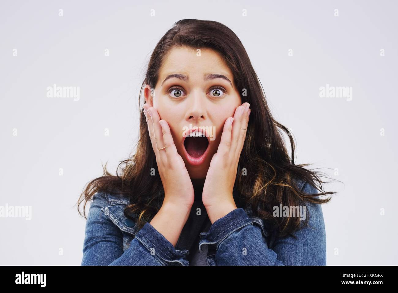 Flabbergasted. Studio portrait of an attractive young woman looking ...