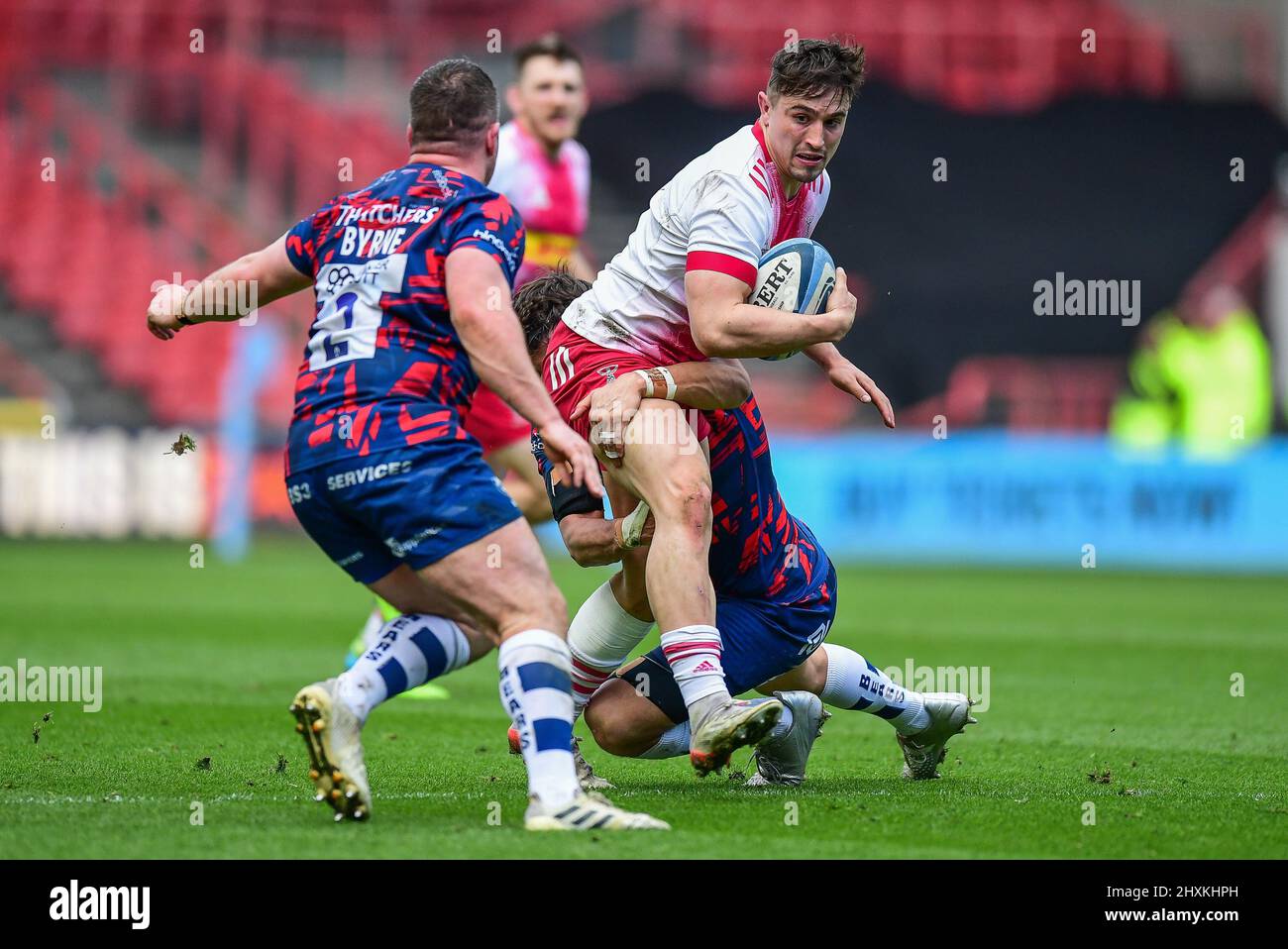 Cadan Murley of Harlequins Rugby, tackled by Antoine Frisch of Rugby ...