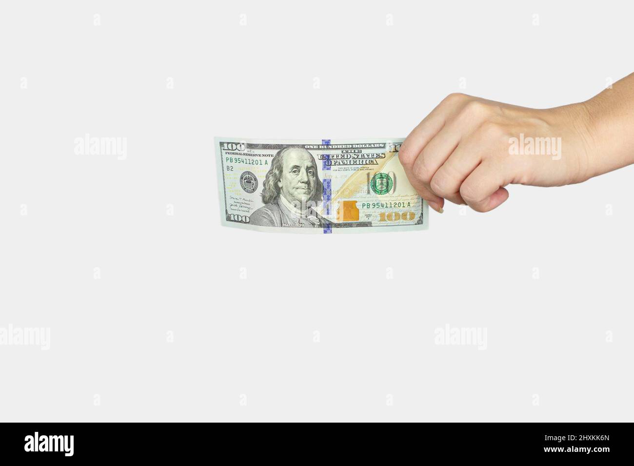Woman hand with money isolated on white background. Cropped Hand Of ...