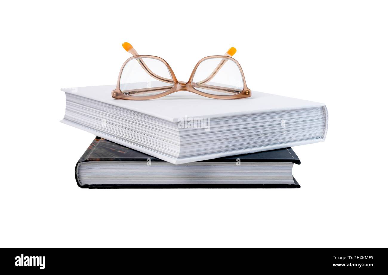 Books stack with eyeglasses isolated on white background. Encyclopedia ...