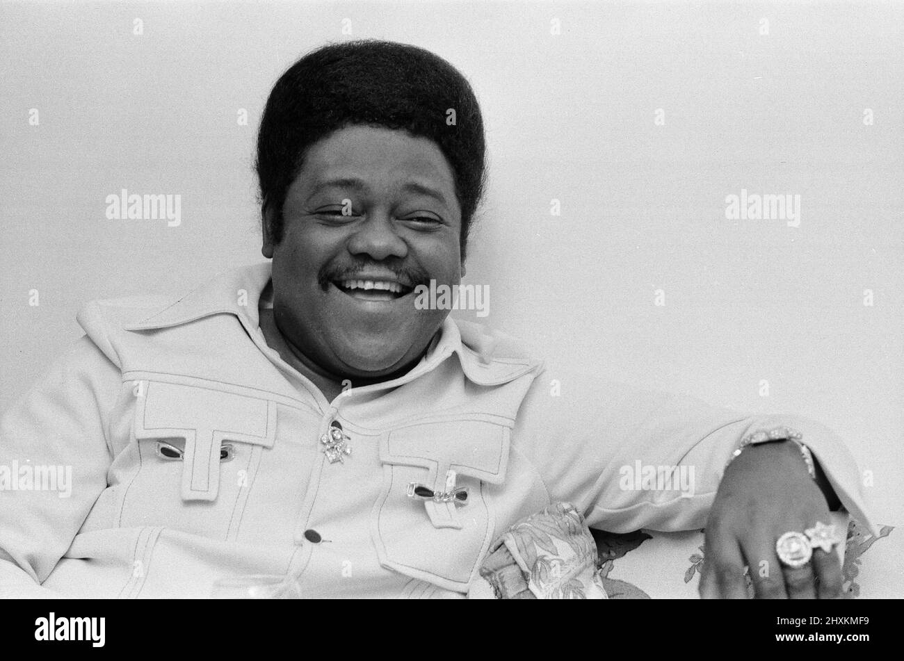 American rock and roll singer and musician Fats Domino shows off his ...