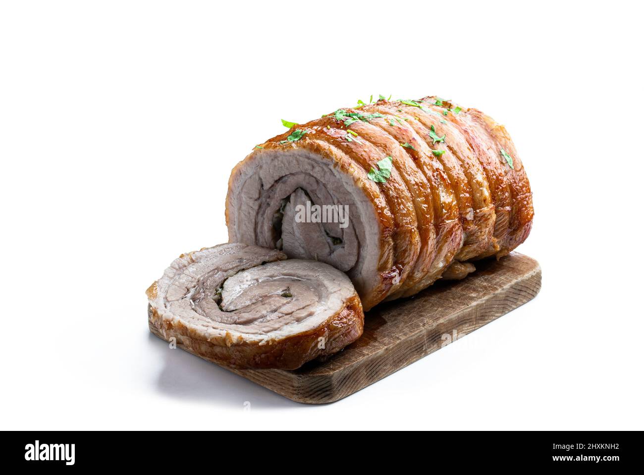 Roasted pork meat roll with herbs and spices isolated on white Stock ...
