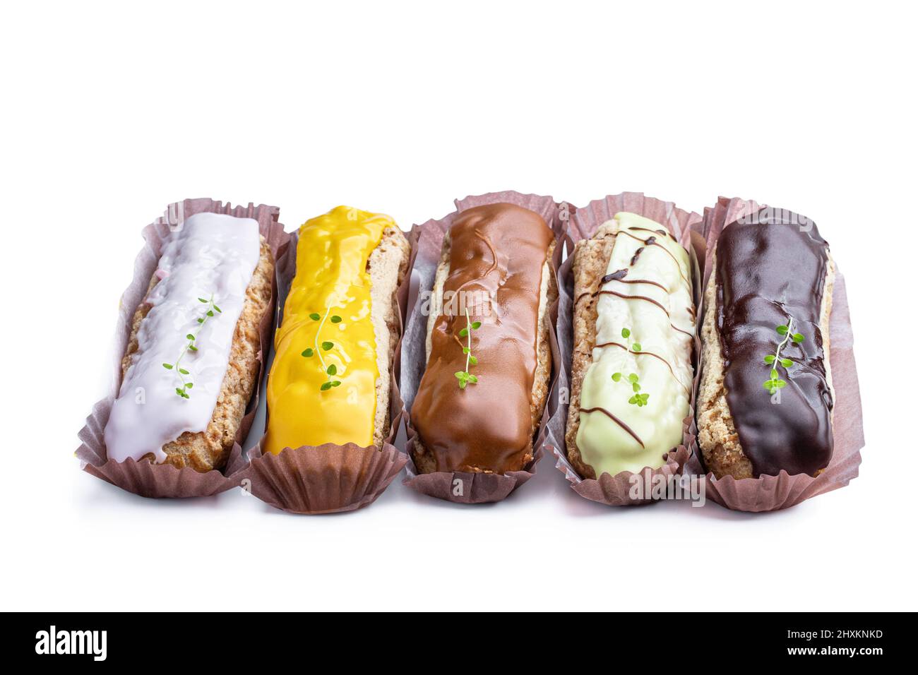Set of decorated eclairs isolated on white Stock Photo - Alamy