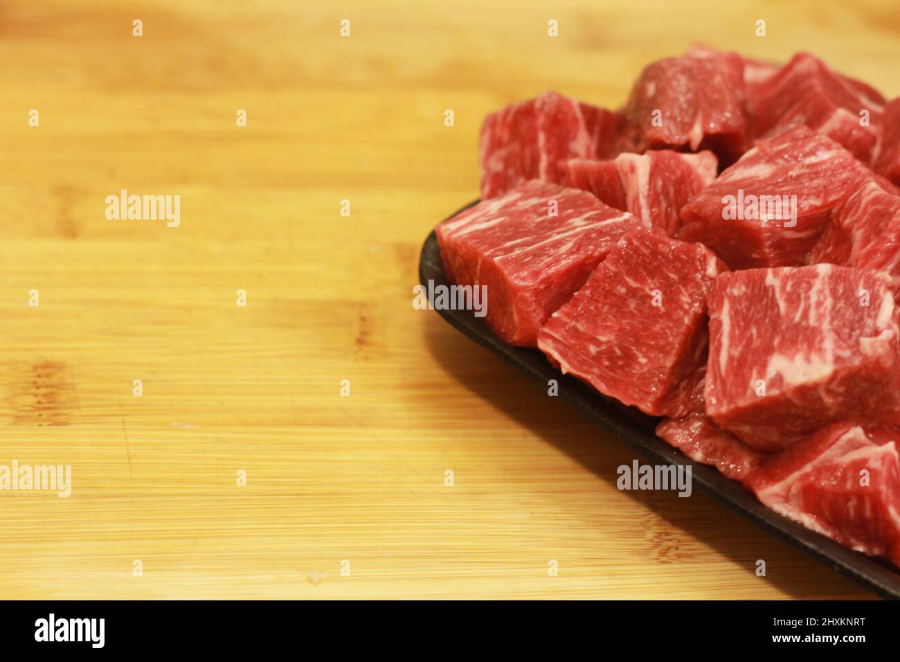 Square size chopped red beef cube Stock Photo - Alamy