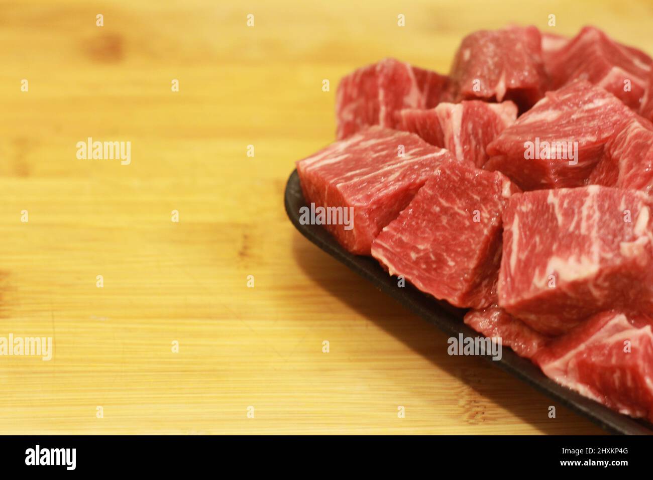 Square size chopped red beef cube Stock Photo - Alamy