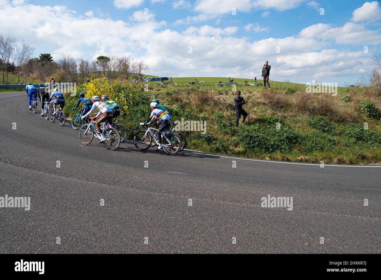 Italy, 12 March 2022 - professional cyclists travel an uphill road ...
