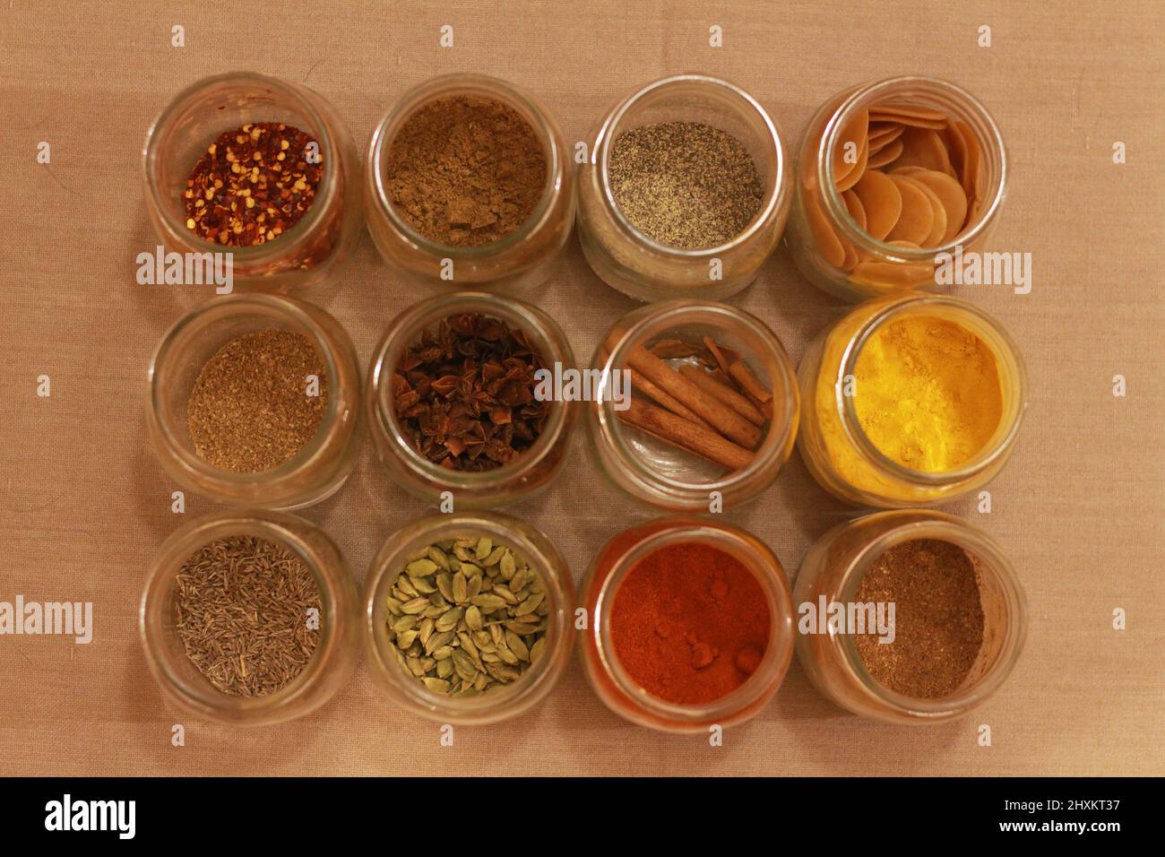 Cooking ingredients masala in glass jars Stock Photo - Alamy