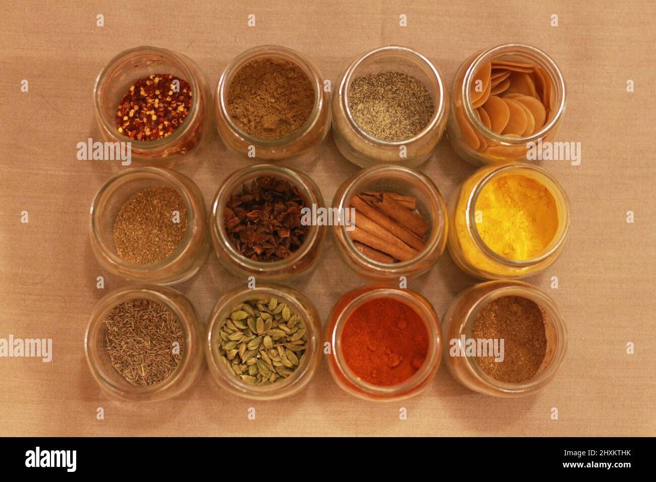 Cooking ingredients masala in glass jars Stock Photo - Alamy