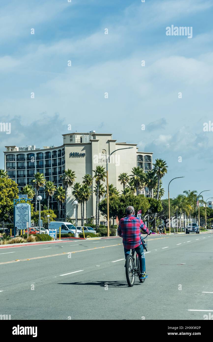 Person riding bicycle palm trees hi-res stock photography and images ...