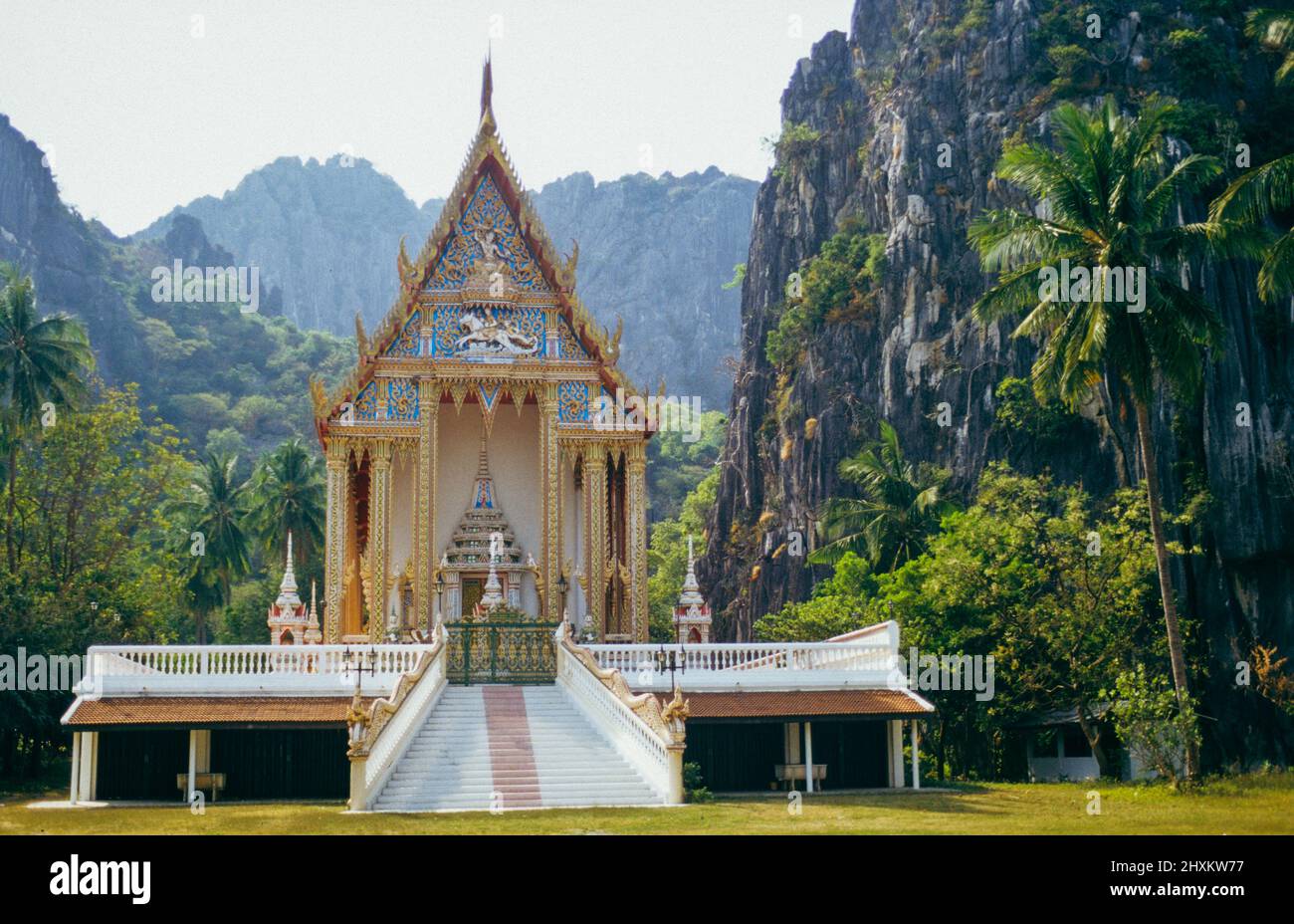 Buddhist Wat Khao Daeng temple at Khao Sam Roi Yot National Park draws ...