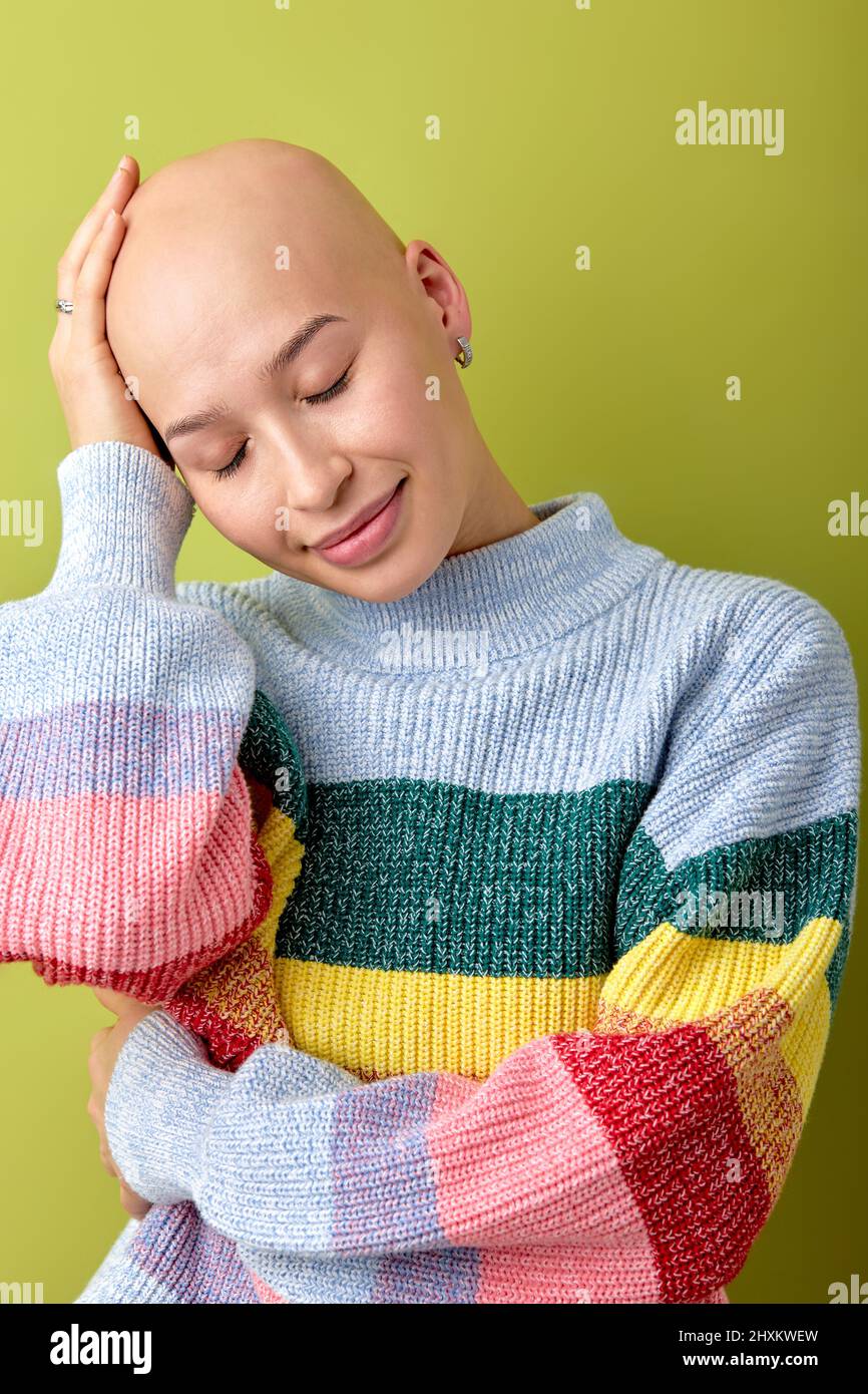 Portrait of lovely caucasian bald lady in bright colorful shirt ...