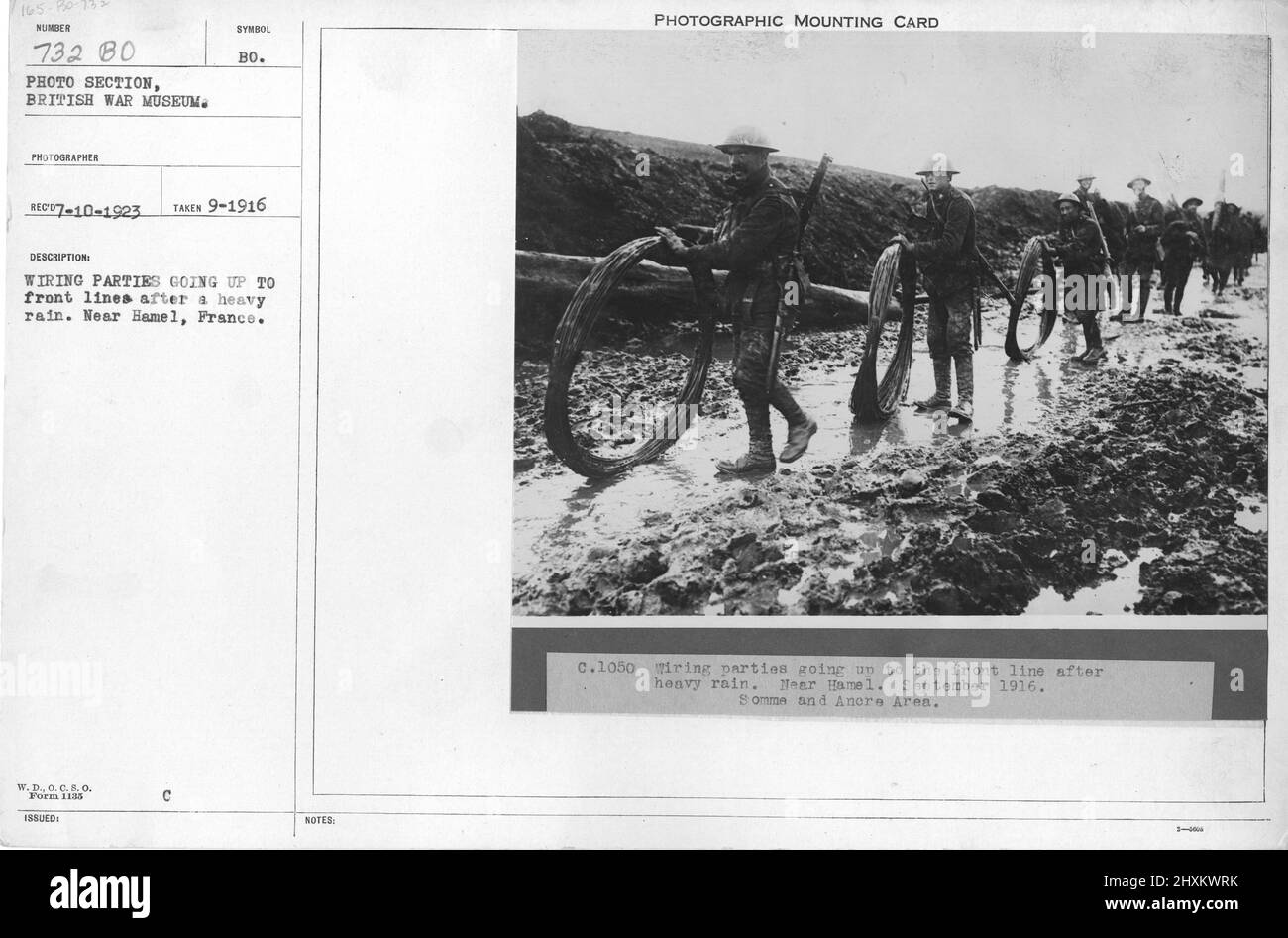Wiring parties going up to front lines after a heavy rain. Near Hamel ...