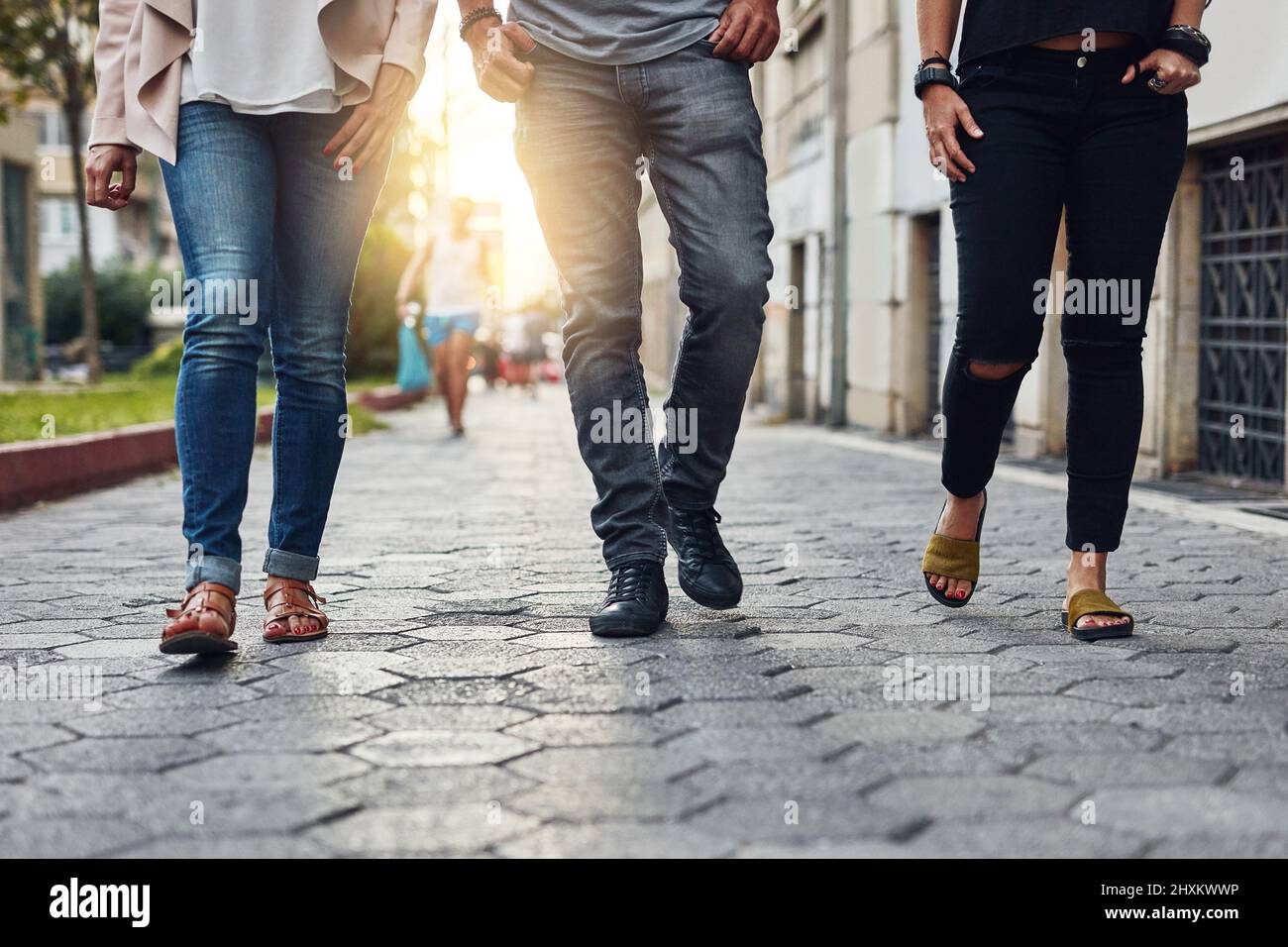 These streets were made for walking. Cropped shot of three people ...