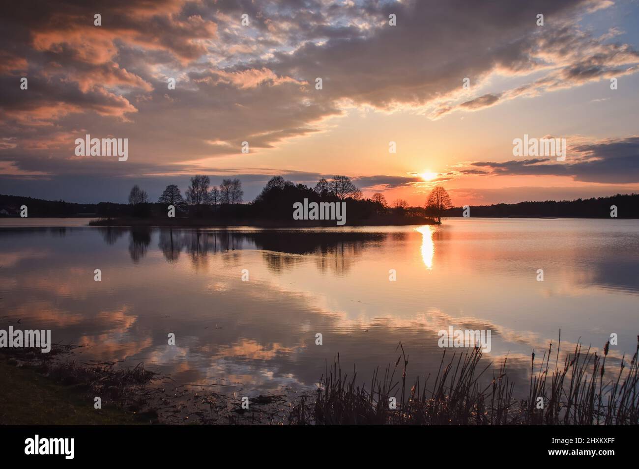 Wonderful morning landscape in Poland. The sun over the lake in a ...