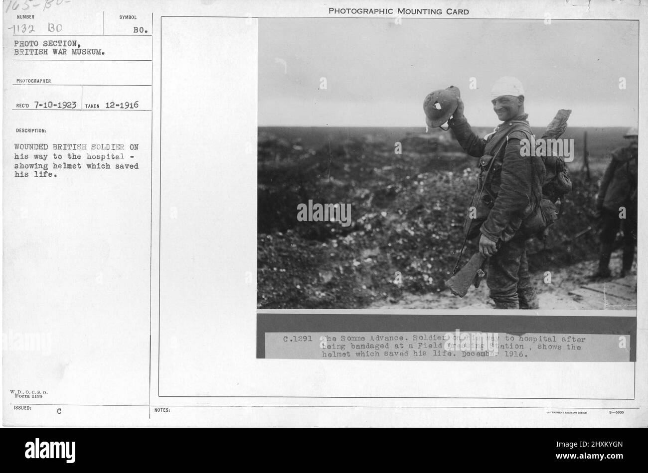 Wounded British soldier on his way to the hospital- showing helmet ...