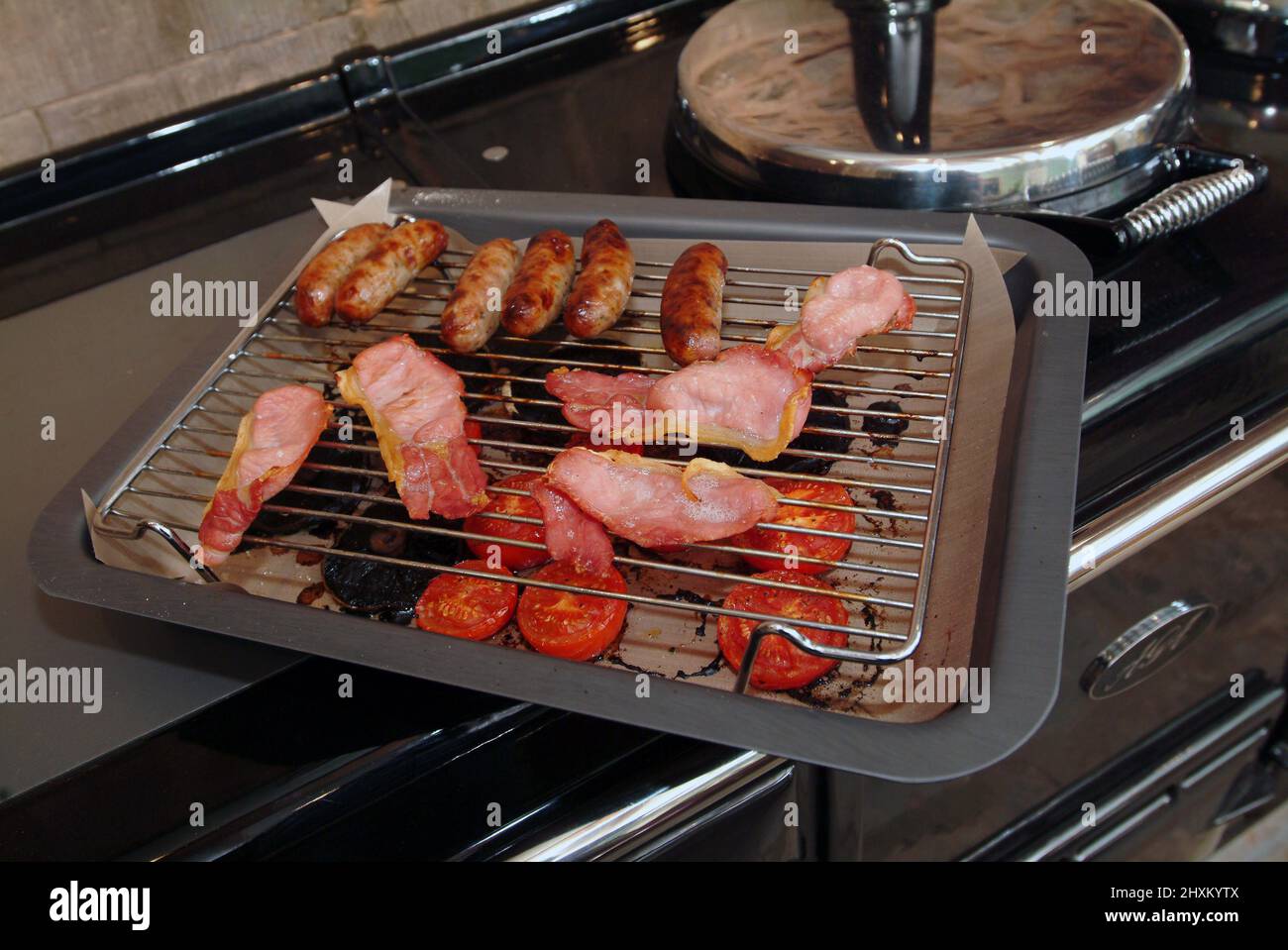 Cooking a traditional English breakfast on an Aga cooker Stock Photo ...