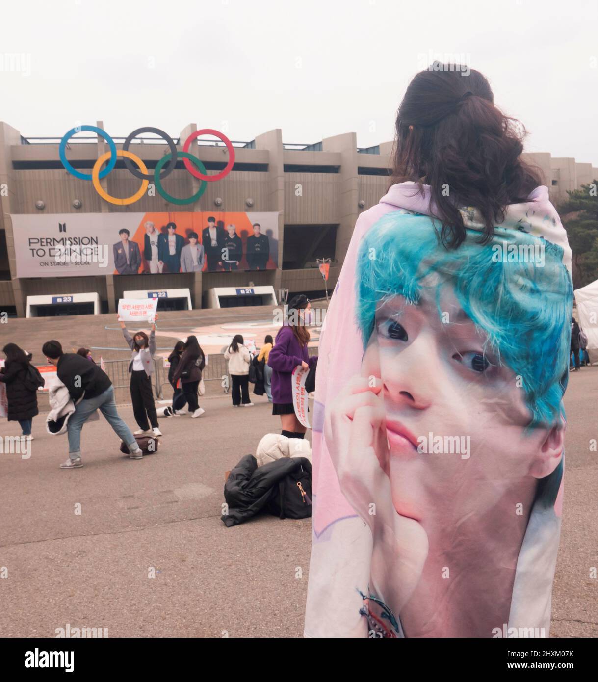 BTS Concert, March 12, 2022 : BTS fans take photos in front of a venue ...