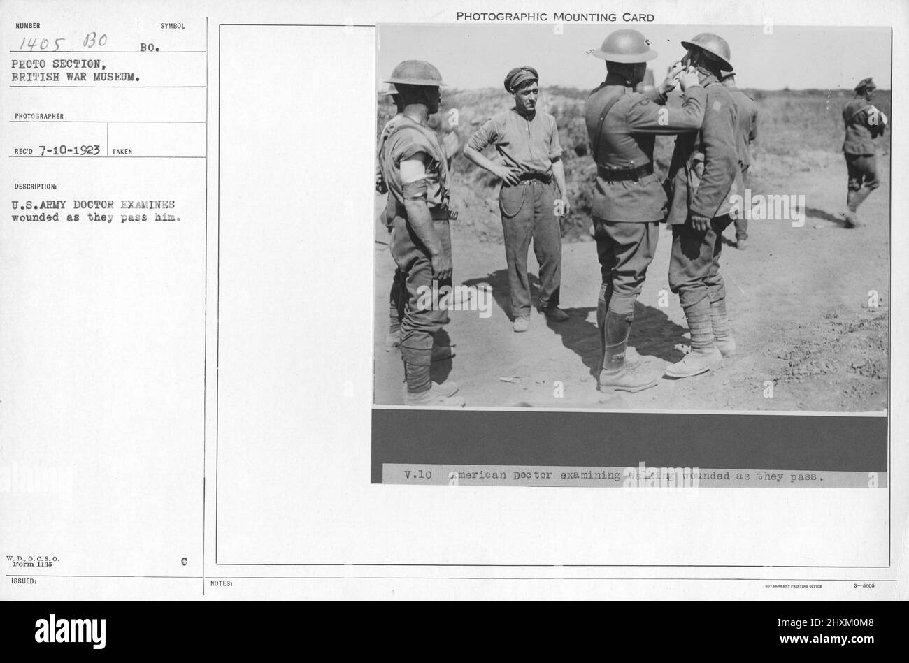 U.S. Army doctor examines wounded as they pass him. Collection of World ...