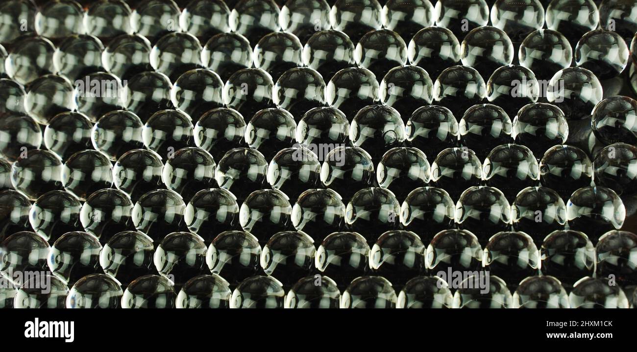 Black geometric abstract background of gel balls. Macro of dark ...