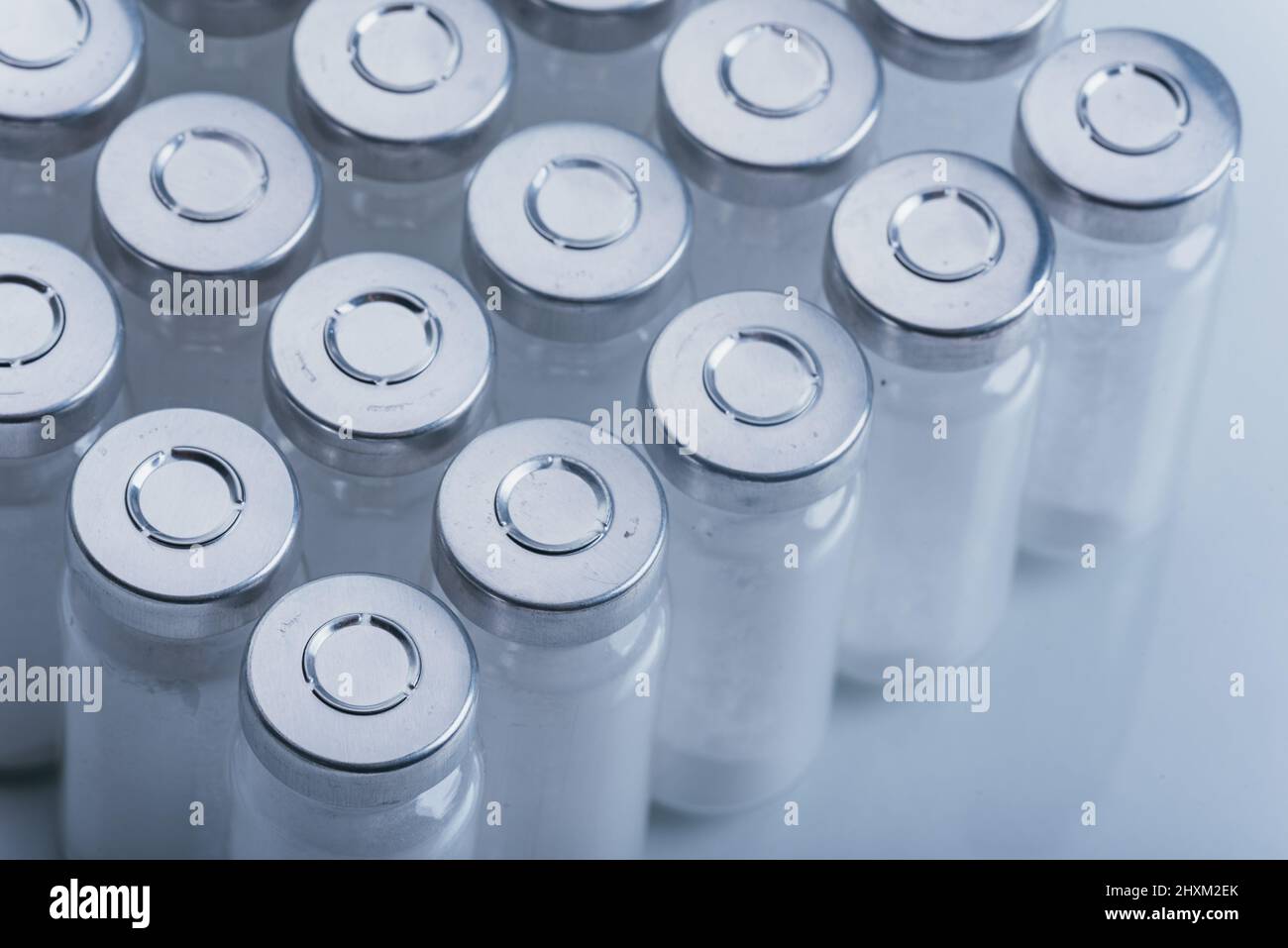 Glass medical ampoule vial for injection. Medicine is dry white drug ...