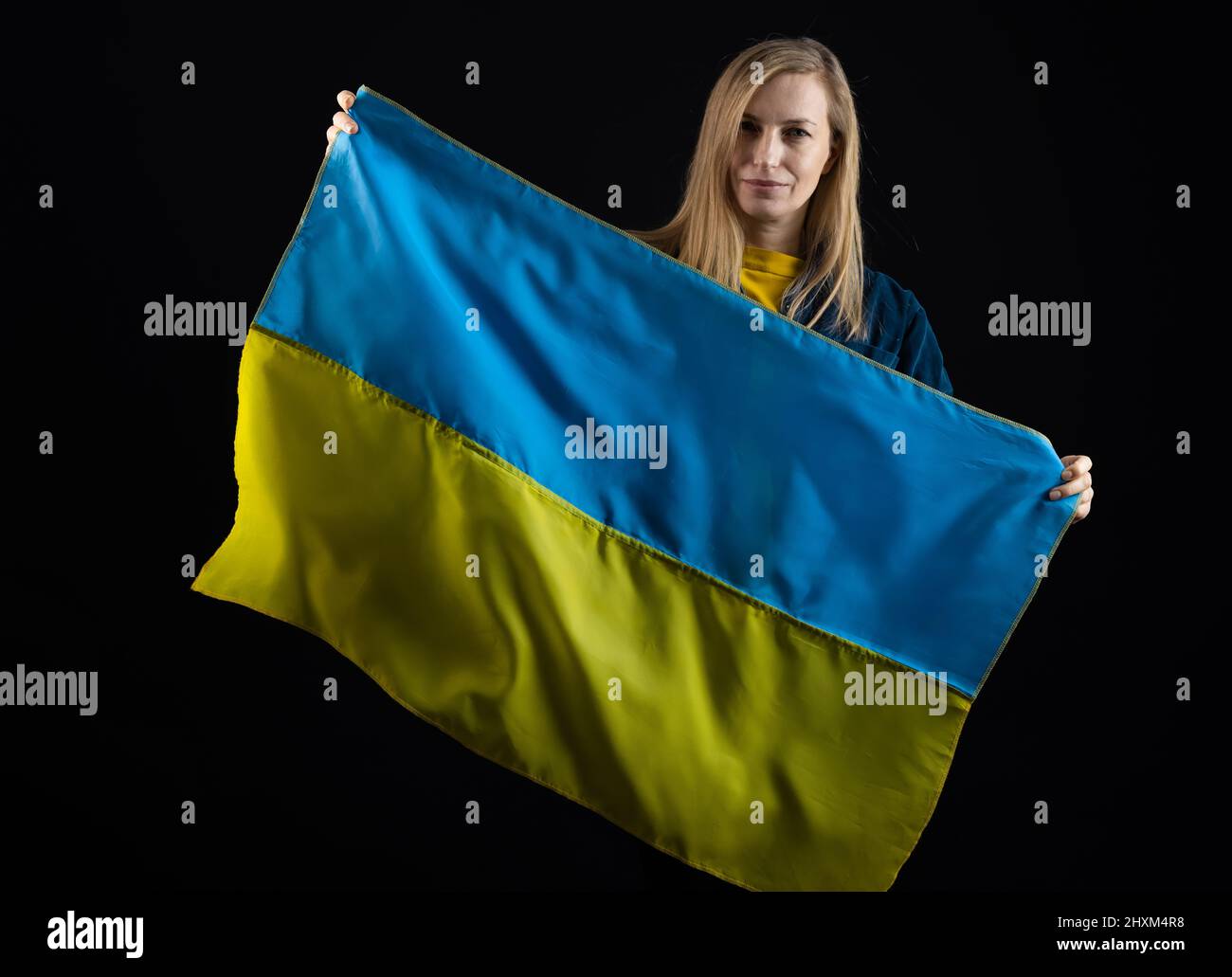 Woman holds ukrainian flag Stock Photo - Alamy