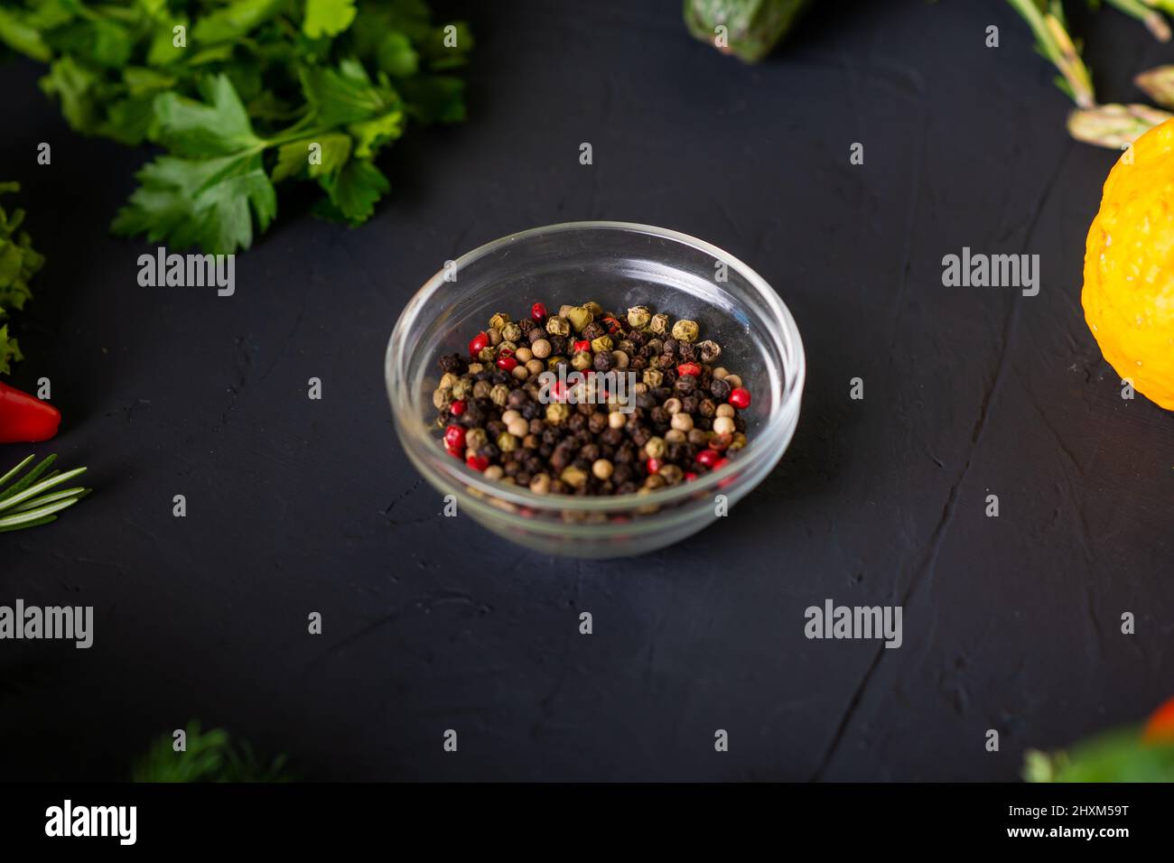 Whole red and black peppers. Dark background. Various vegetables Stock ...