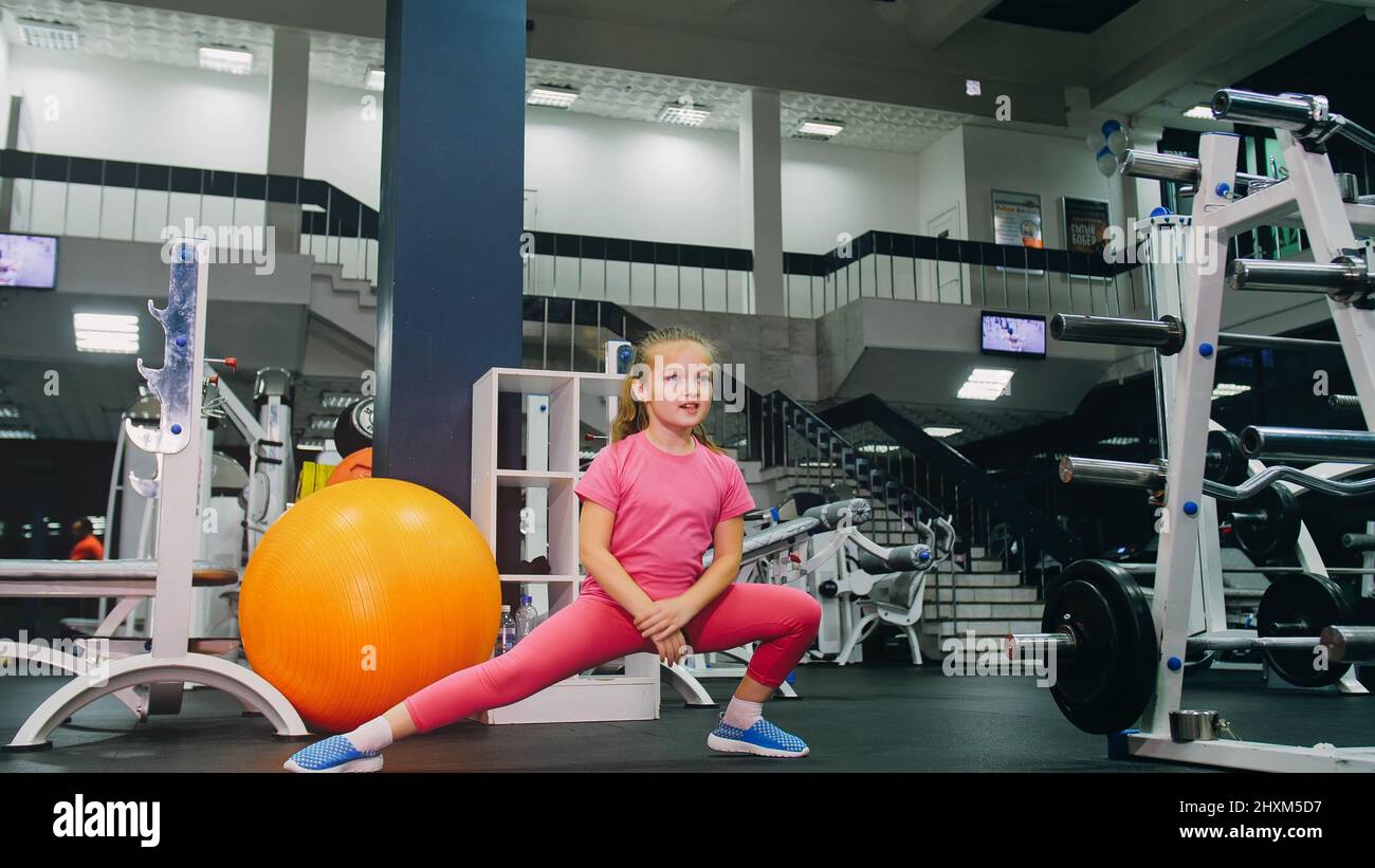 Fit Athletic Baby Girl Work out Stretching, Doing Her Fitness Exercise ...