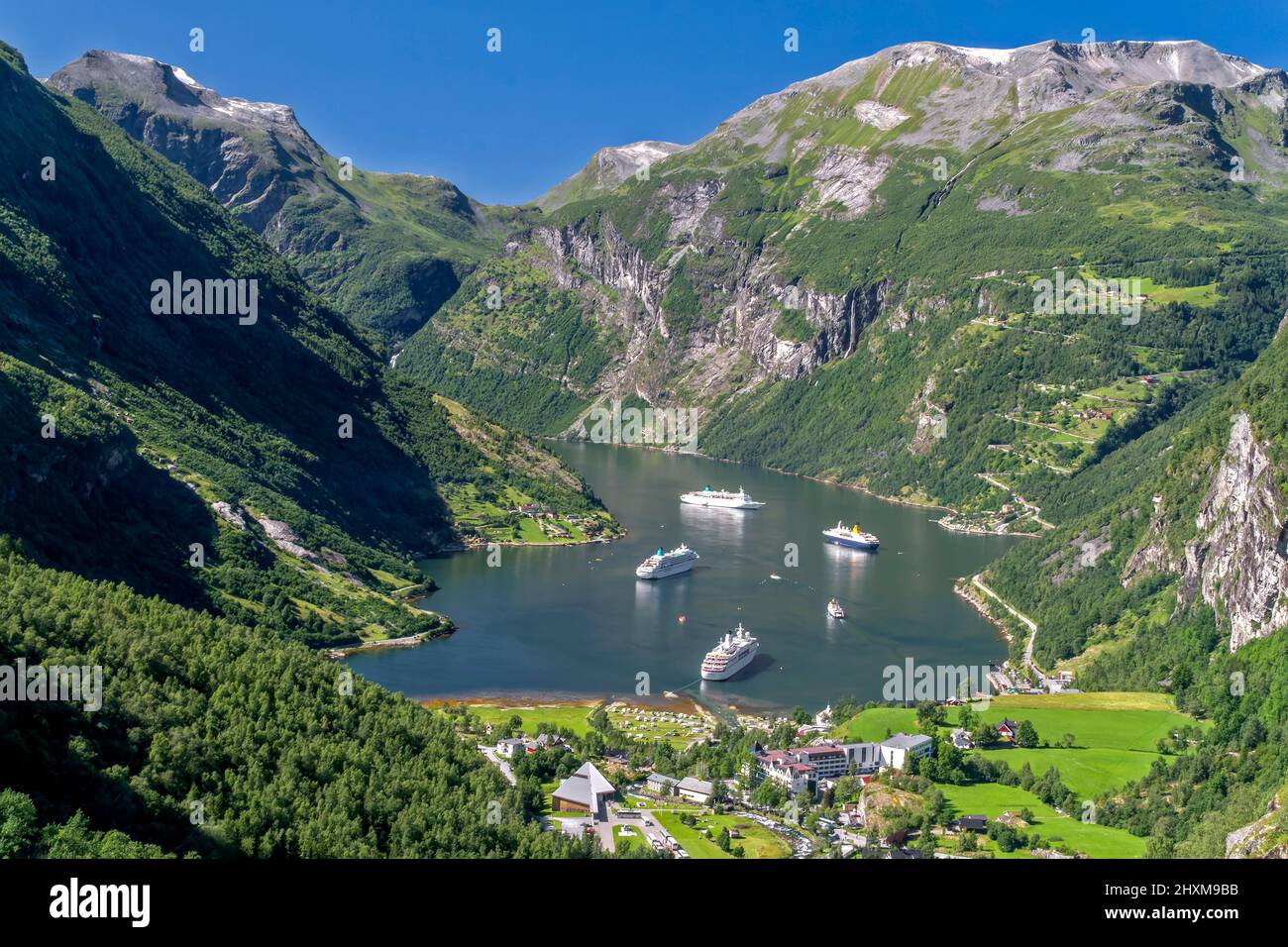 view of Geirangerfjord port with several cruise ships at anchor, from ...