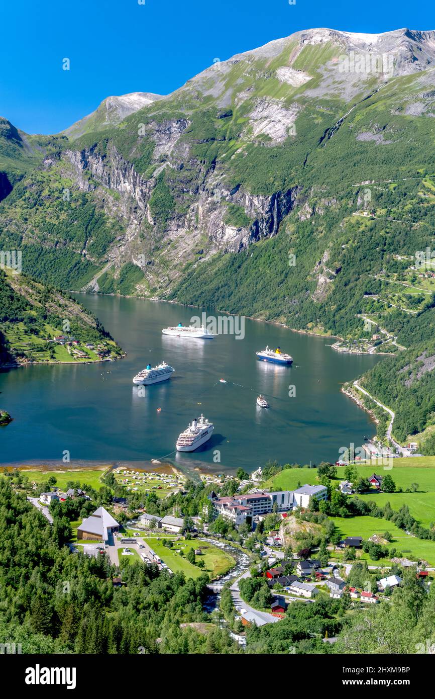 view of Geirangerfjord port with several cruise ships at anchor, from ...