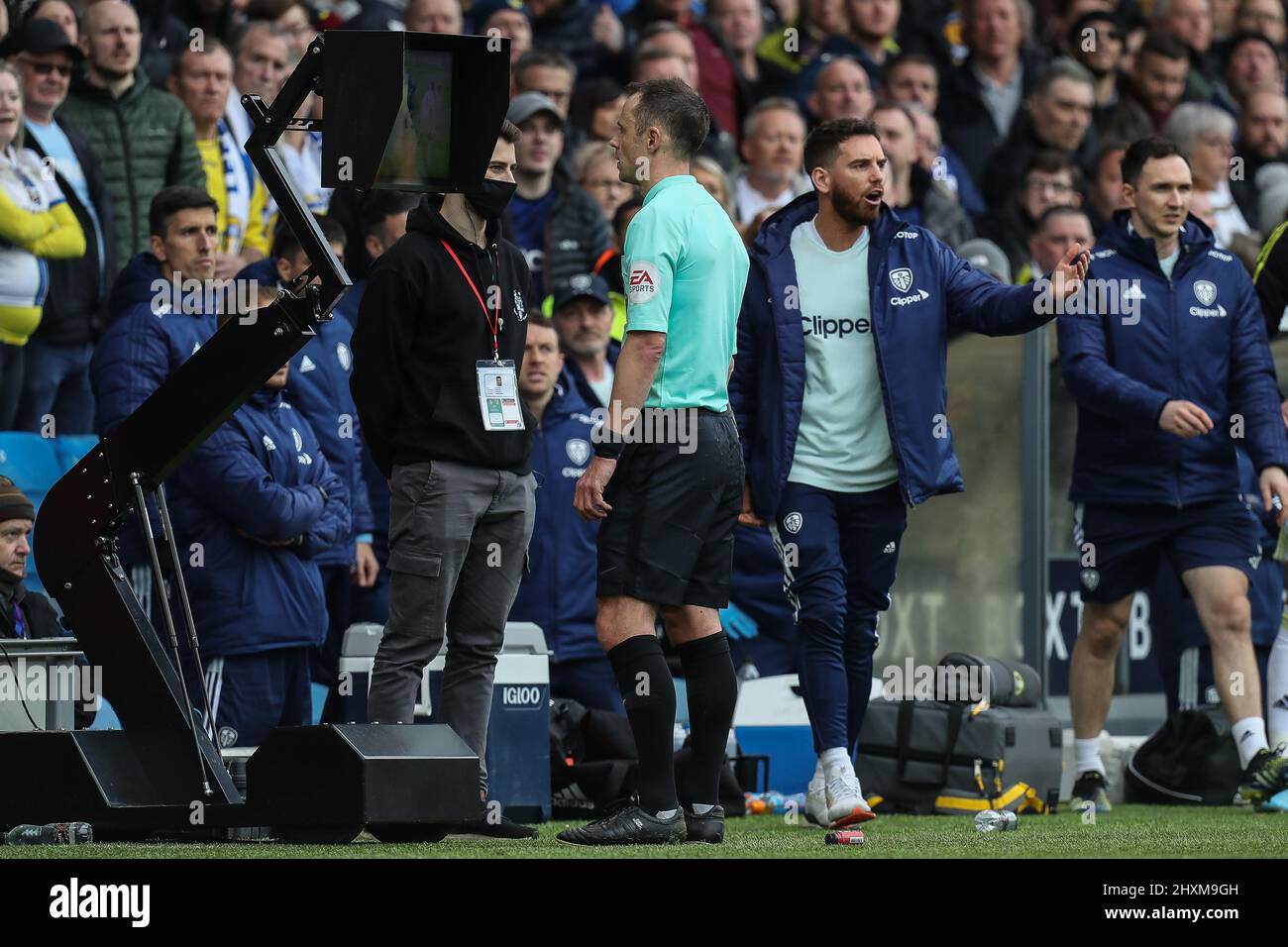 Referee Stuart Attwell watches the VAR screen during the second half ...