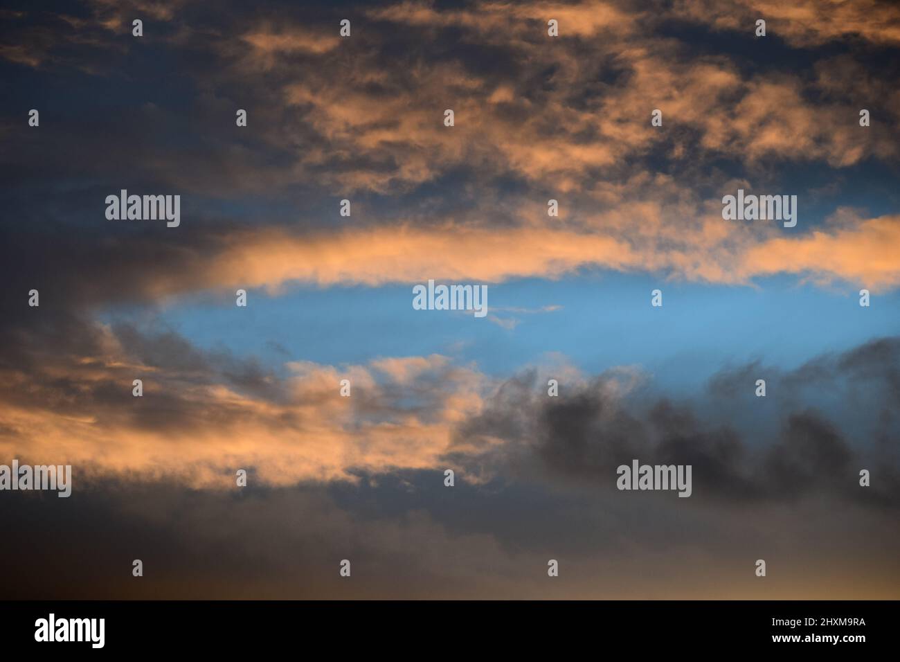 Cloud shapes and colours at sunset Stock Photo - Alamy