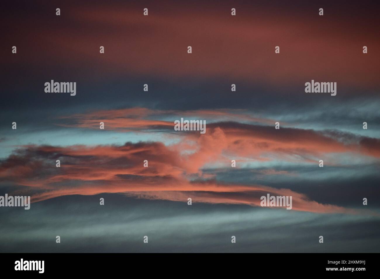 Shapes and patterns in the clouds set ablaze by the setting sun Stock ...