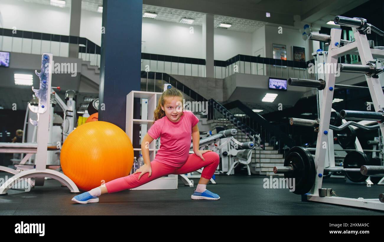 Fit Athletic Baby Girl Work out Stretching, Doing Her Fitness Exercise ...