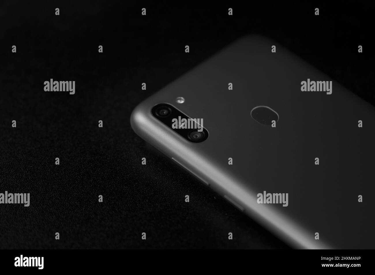 Selective focus on back of new smartphone Samsung Galaxy M11 triple ...
