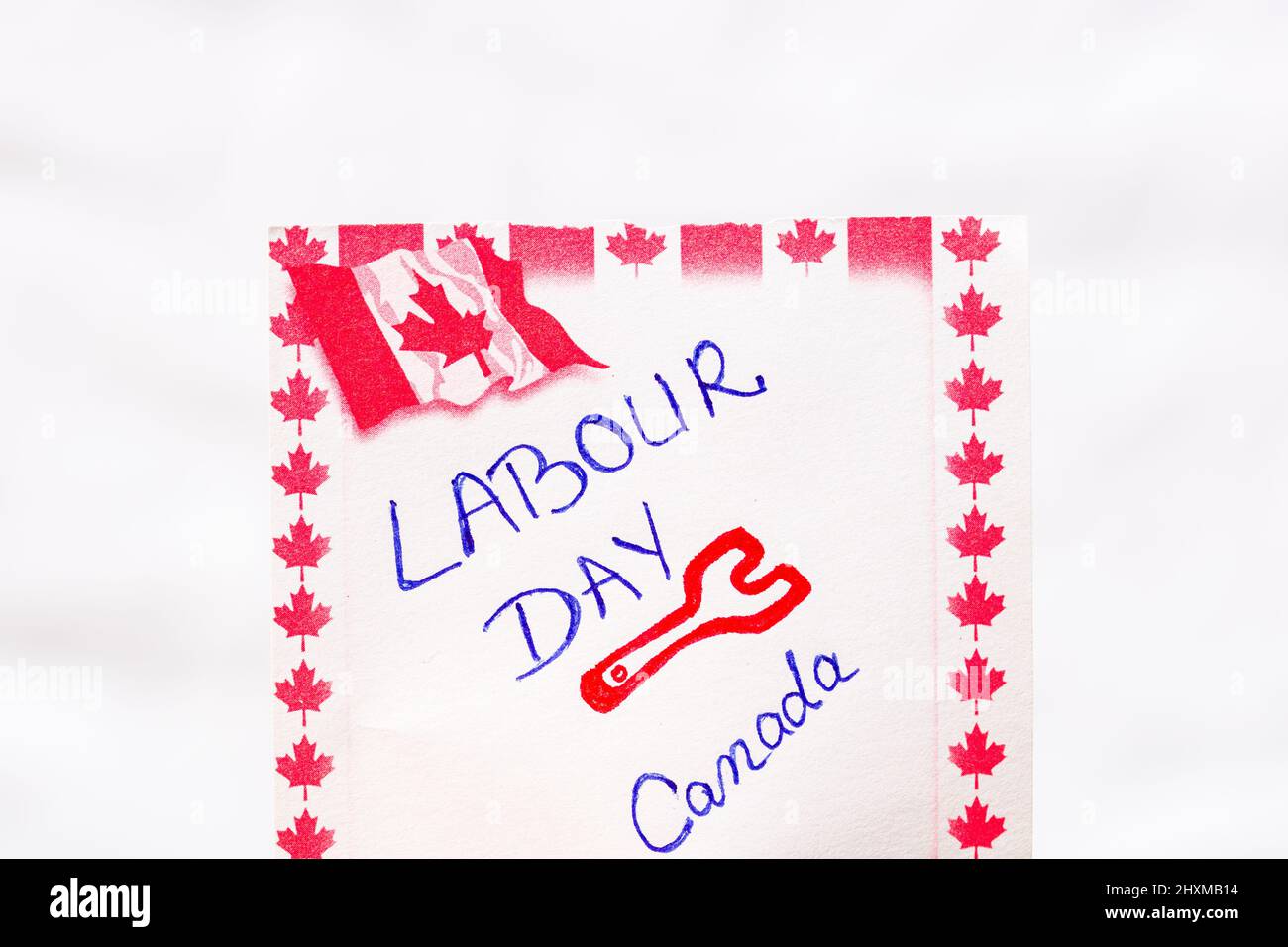 Labour day Canada handwriting on paper with Canada flag. Writing text ...