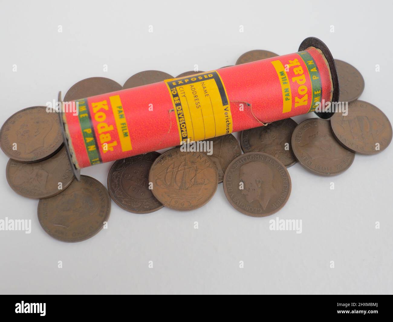 Film roll on top of copper larger pennys Stock Photo - Alamy