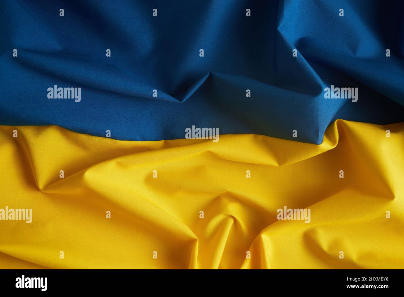 Fabric curved flag of Ukraine. Blue and yellow colors. UA flag ...