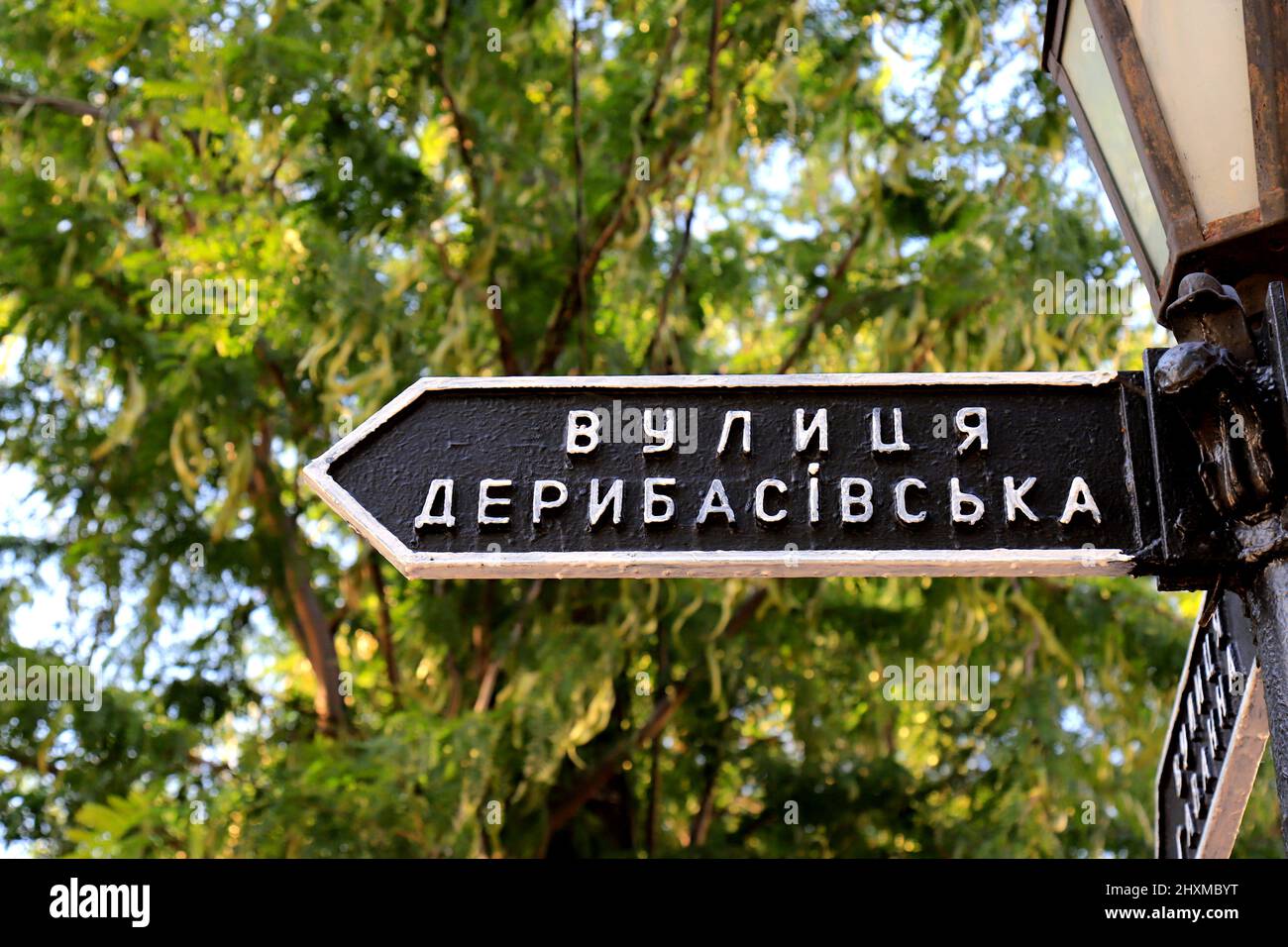 Vintage road sign stands on Deribasovskaya Street in famous city Odessa ...
