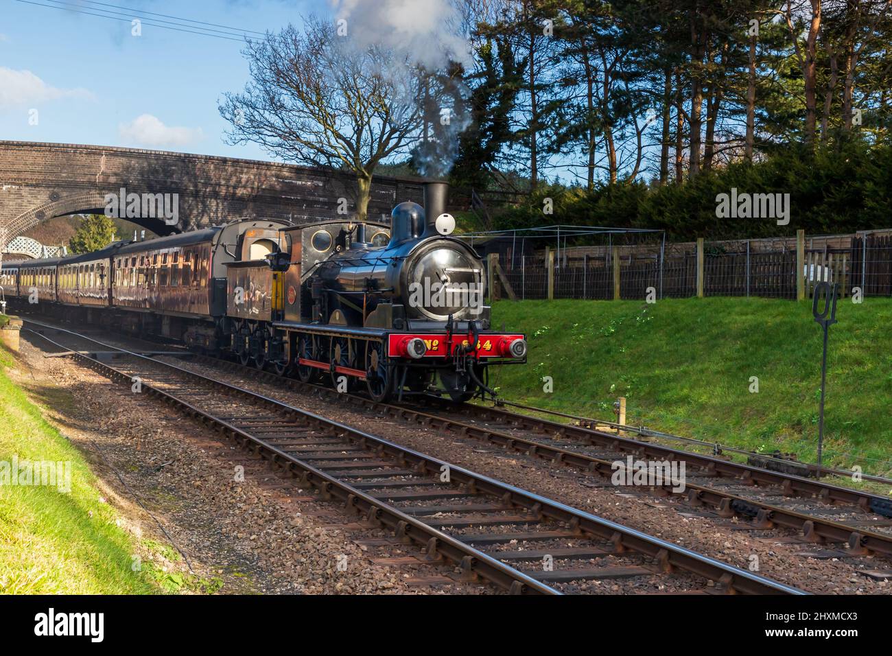 Steam train leaving the Poppy Line station at Weybourne in North ...