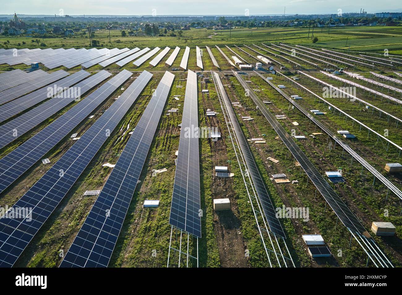 Aerial view of big electric power plant under construction with many ...