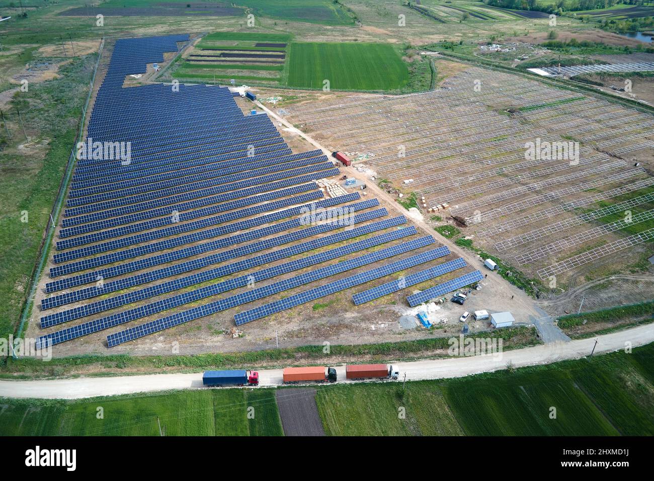 Aerial view of electrical power plant under construction with truck ...