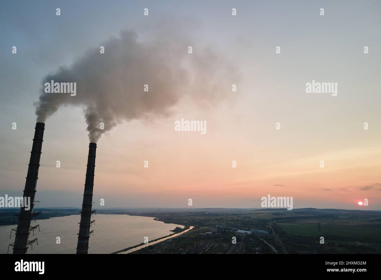Aerial view of coal power plant high pipes with black smokestack ...