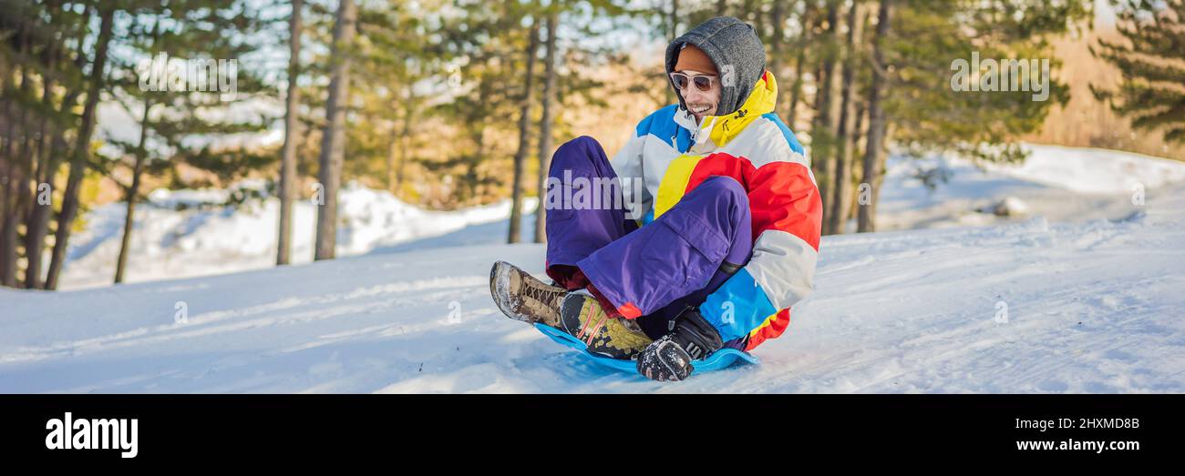 Adult man sliding down slide hi-res stock photography and images - Alamy