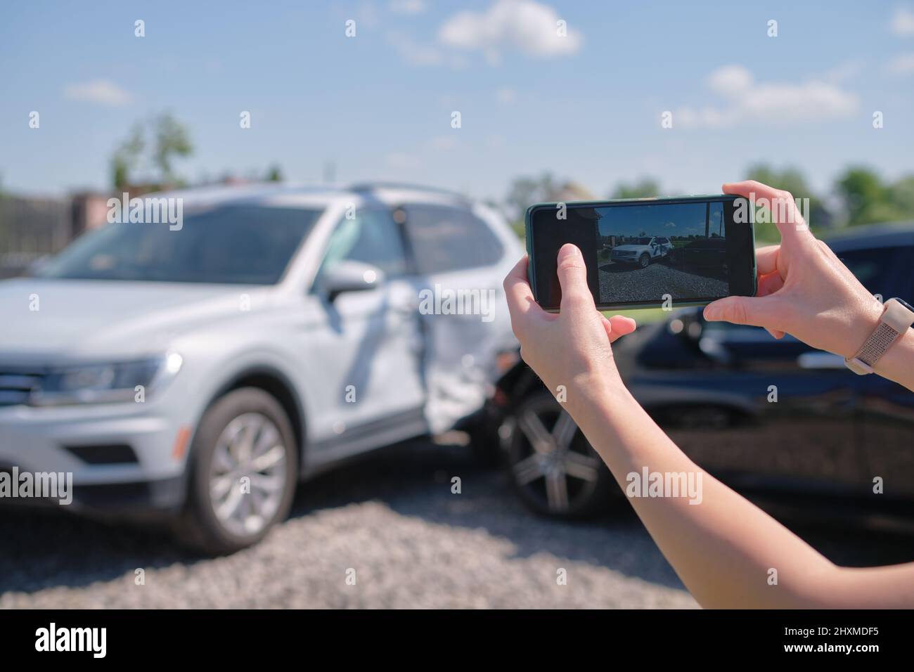 Driver hands taking photo on mobile phone camera after vehicle ...