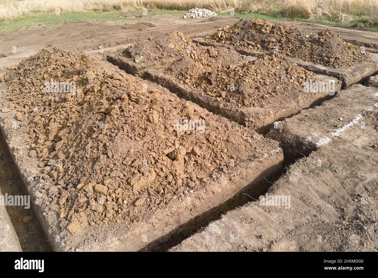 Dug out trench for building works of new house concrete foundation on ...