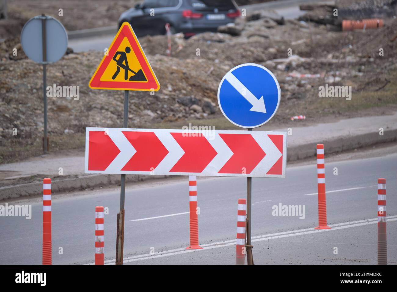 Roadworks warning traffic signs of construction work on city street ...