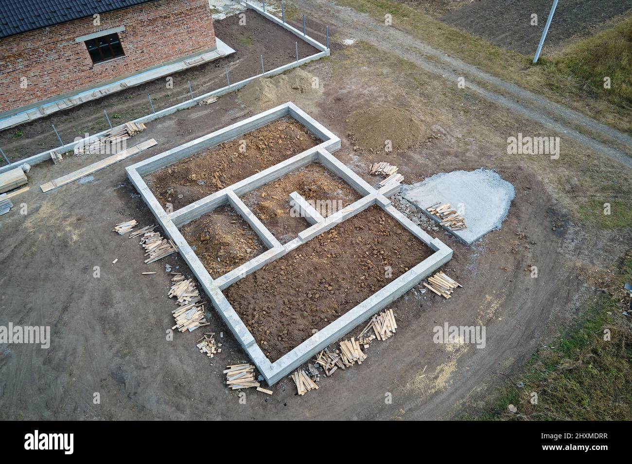 Top down aerial view of building works of new house concrete foundation ...