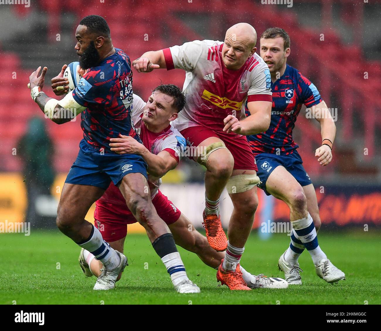Semi Radradra of Rugby Bristol Bears, tackled by Oscar Beard of ...